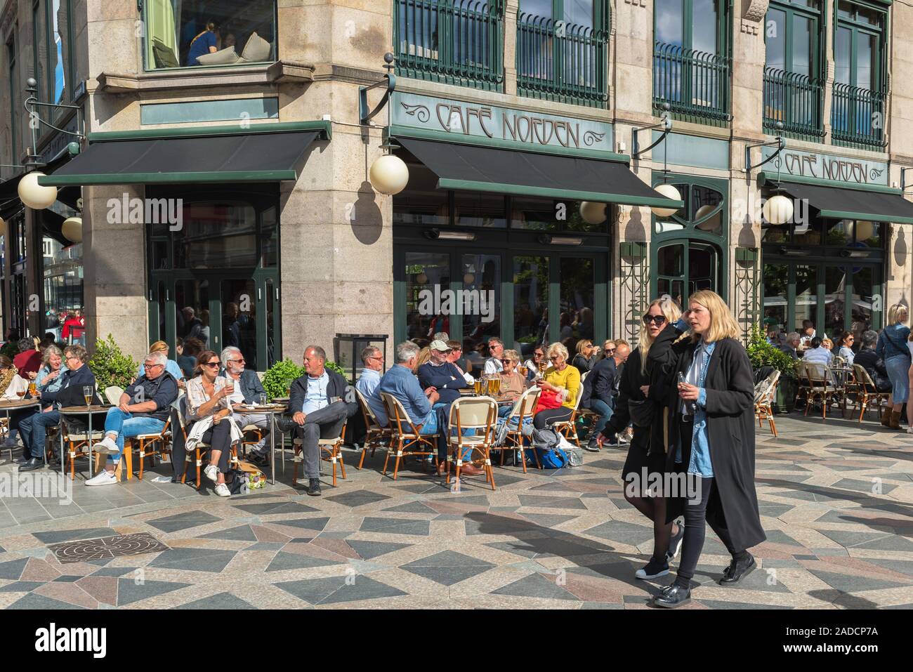 Cafe Norden, view of people relaxing on the sidewalk terrace of the ...