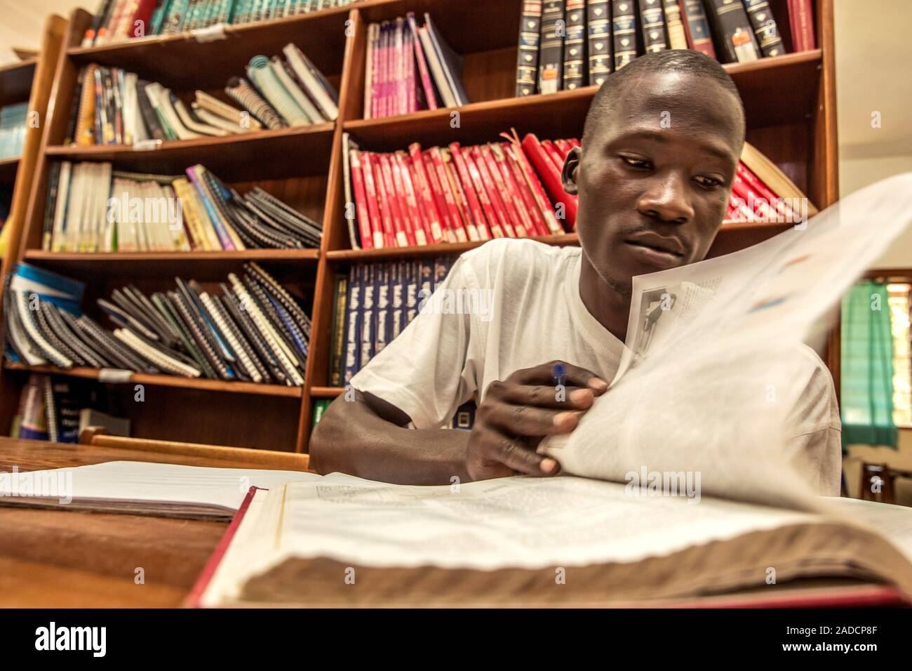 Medical student studying in a library. Photographed at St Mary's ...