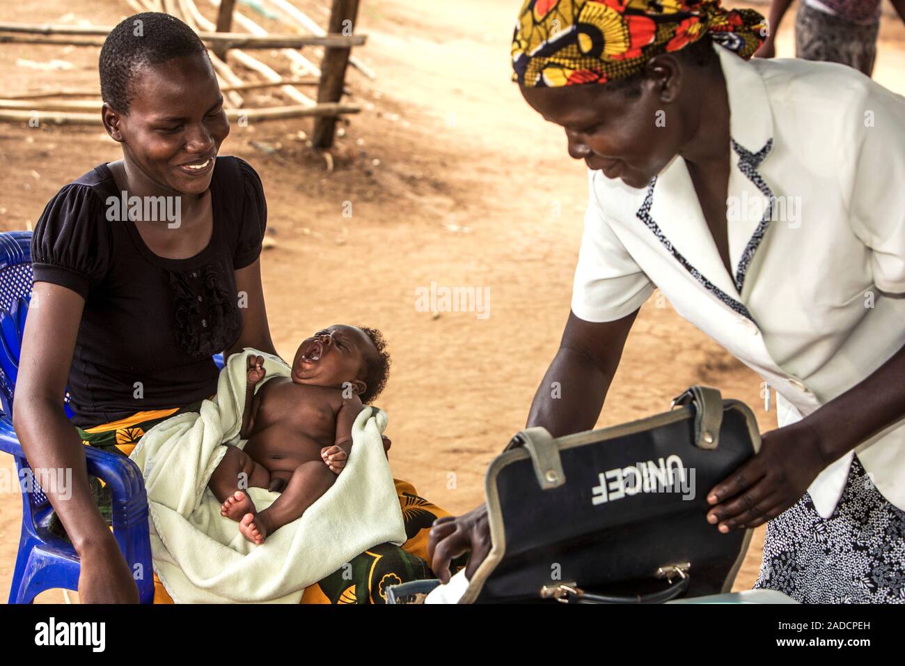 Baby health check. Community nurse preparing to carry out a health ...