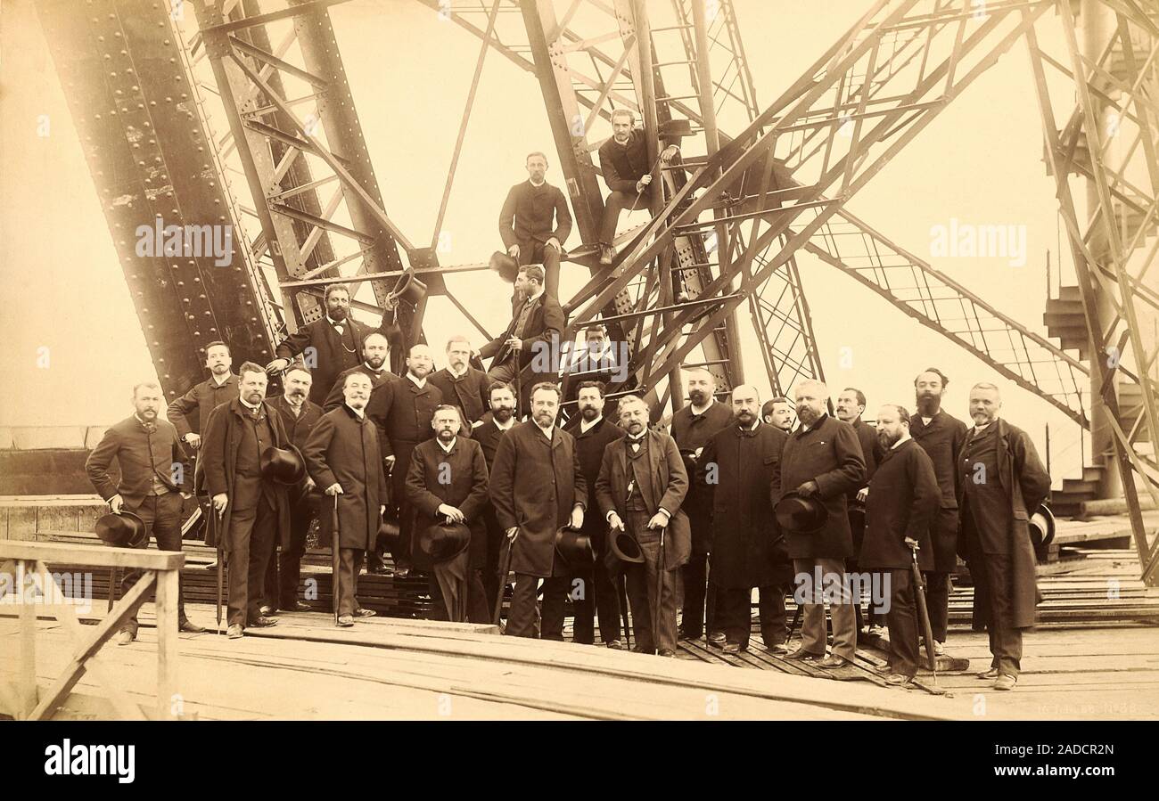 Eiffel Tower architects. Group of architects visiting the Eiffel Tower ...
