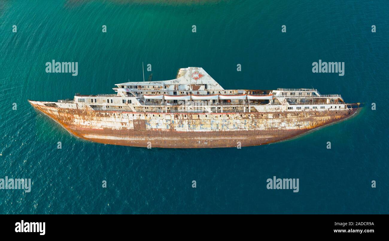 Aerial view of a capsized ship in shallow water Stock Photo - Alamy
