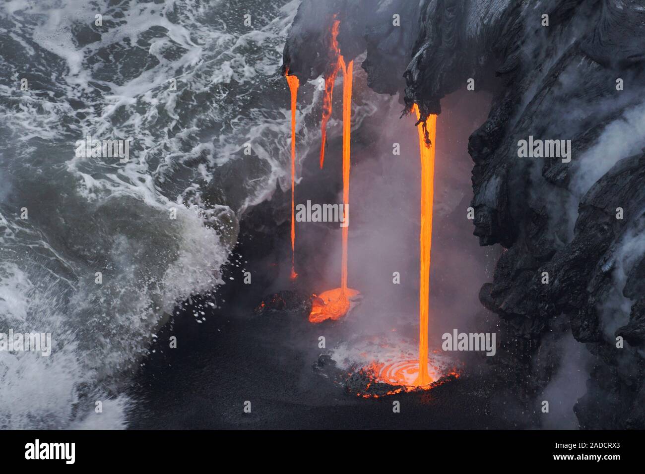 Lava flow entering the sea, Kilauea, Hawaii. This lava flow is from the ...