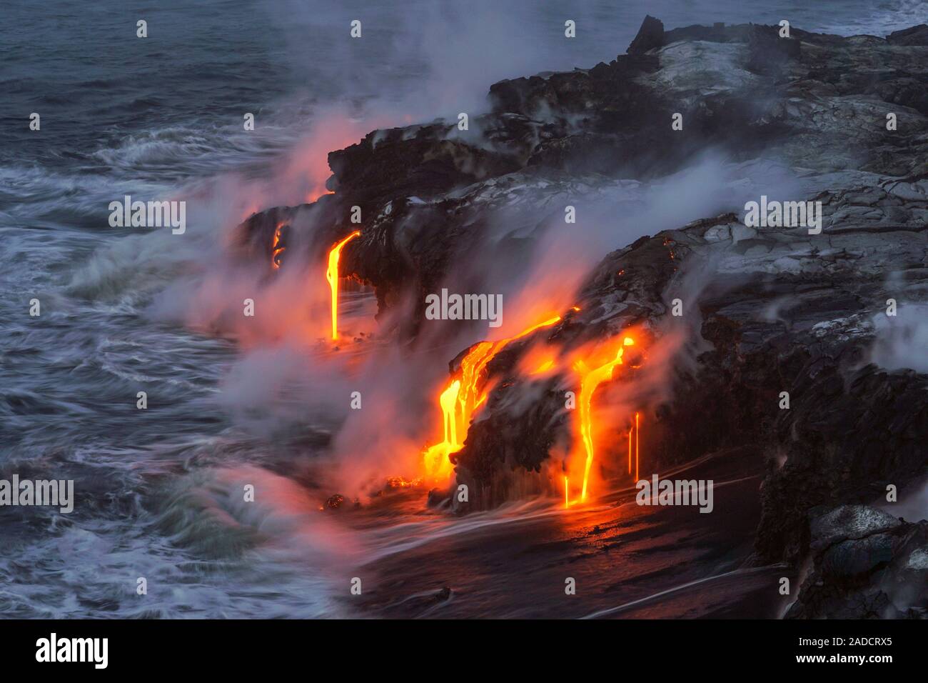 Lava flow entering the sea, Kilauea, Hawaii. This lava flow is from the Kilauea volcano on the ...