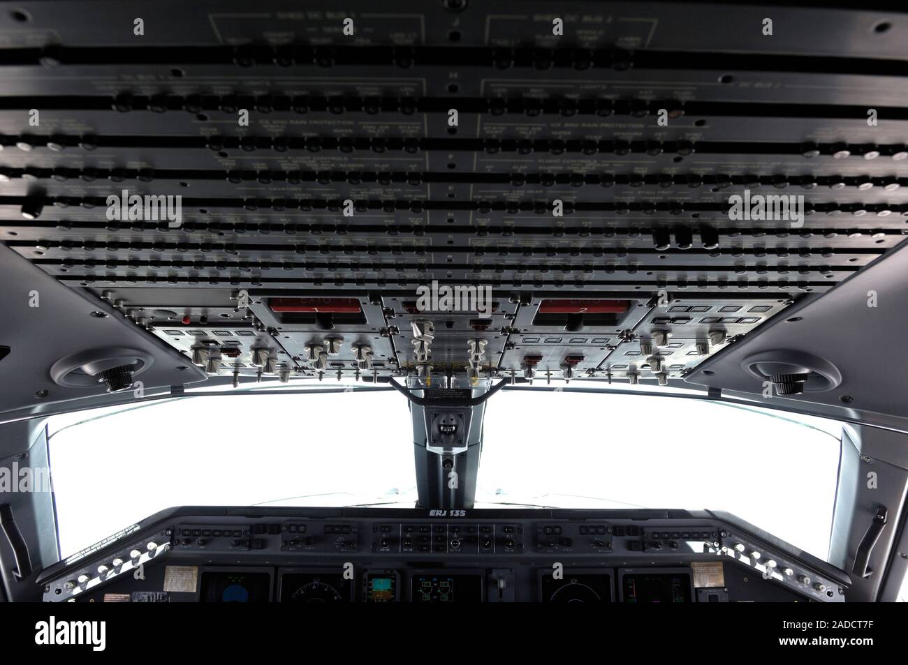 Overhead instruments and windshield of Embraer ERJ-135LR Stock Photo ...