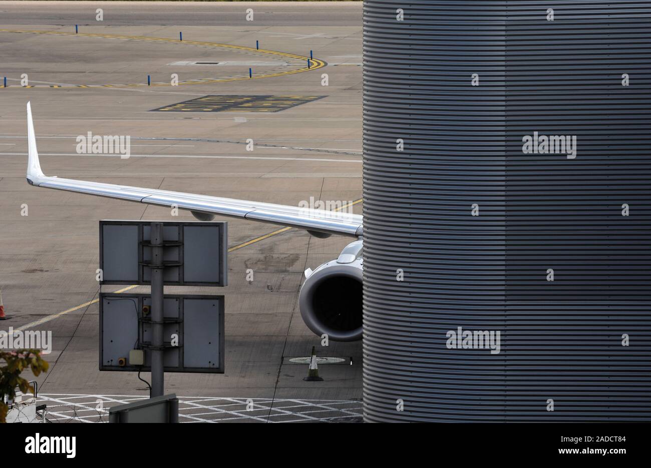 Passenger aircraft wing and engine at Manchester Airport Terminal 3, UK ...