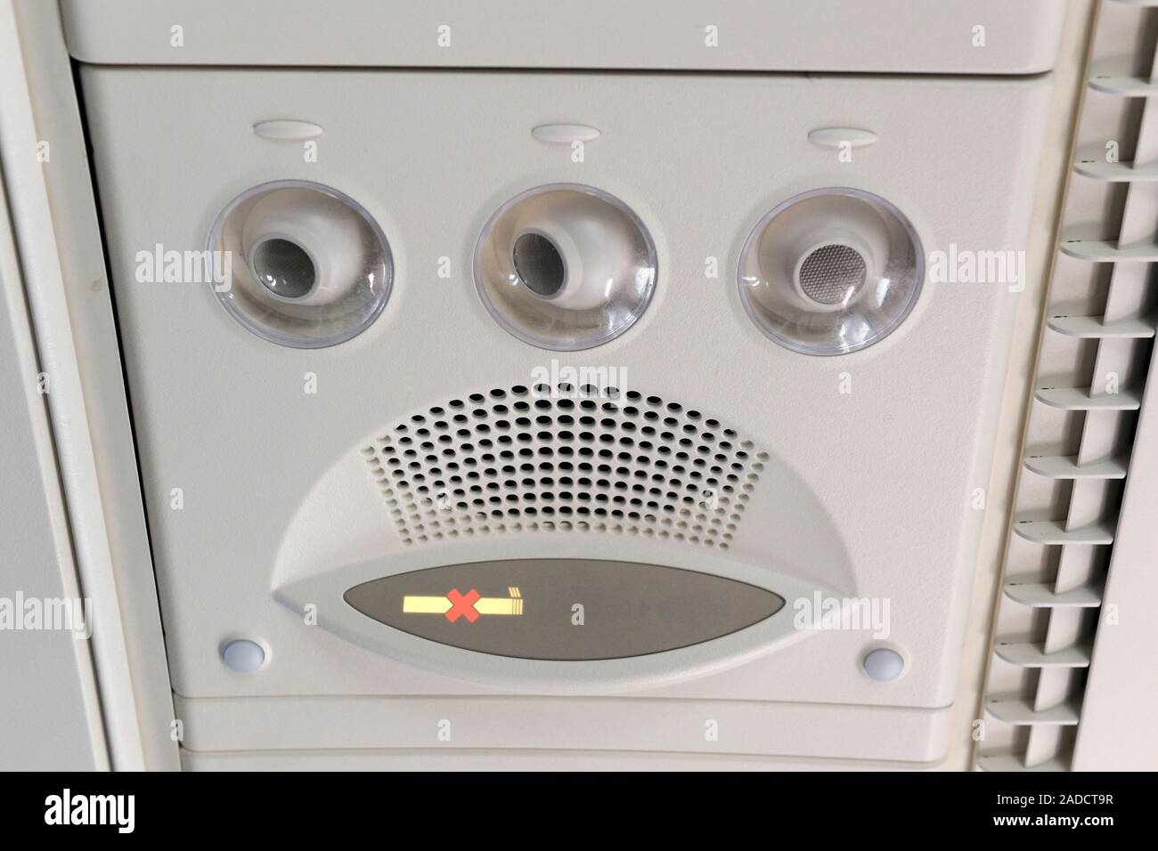 Overhead fresh-air vents and no smoking sign in the economy class cabin ...