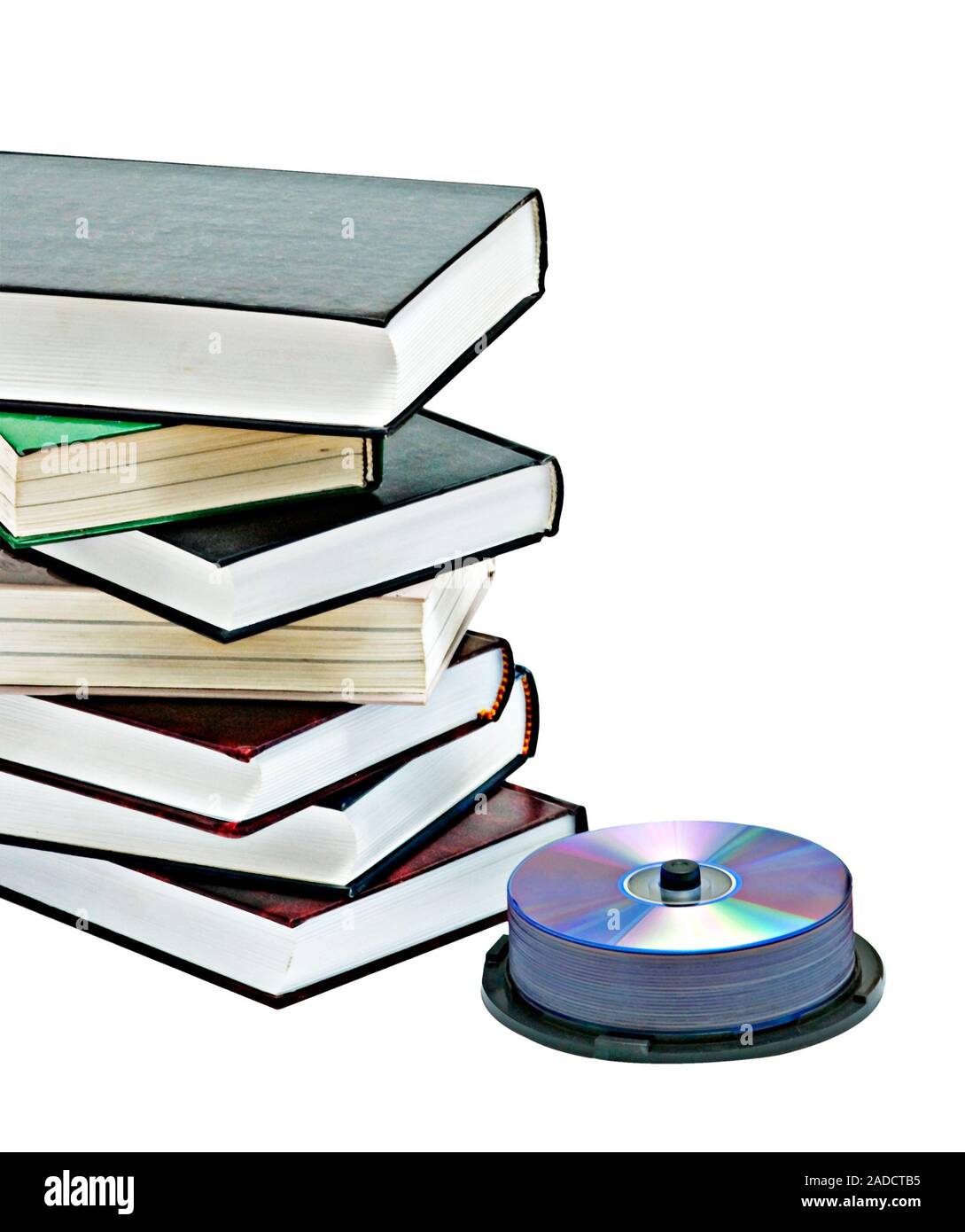 Pile of books and DVD disk as symbols of old and new methods of ...