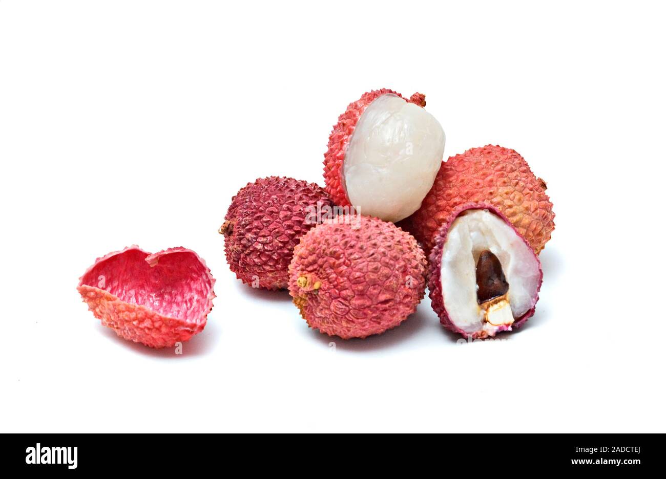 Pile of lychees and section isolated on white background Stock Photo ...