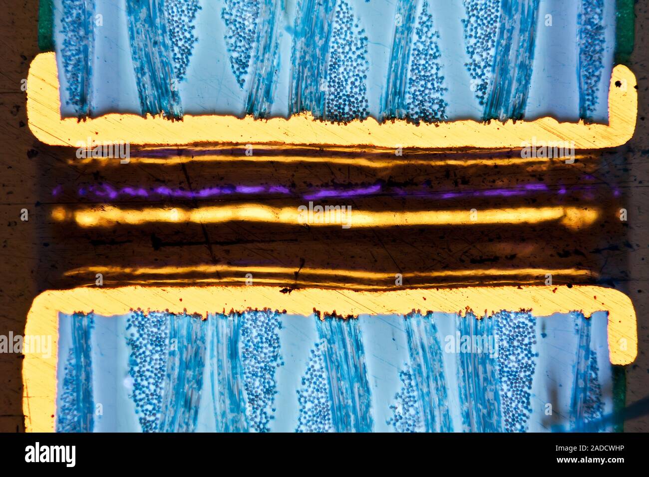 Light micrograph of a section through a computer multilayer printed ...