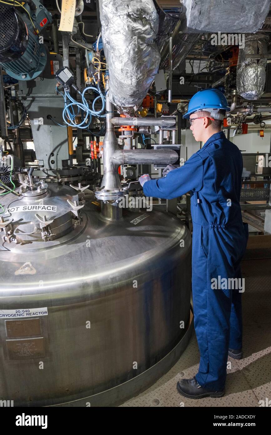 CalaChem chemical factory. Worker checking a cryogenic stainless steel ...