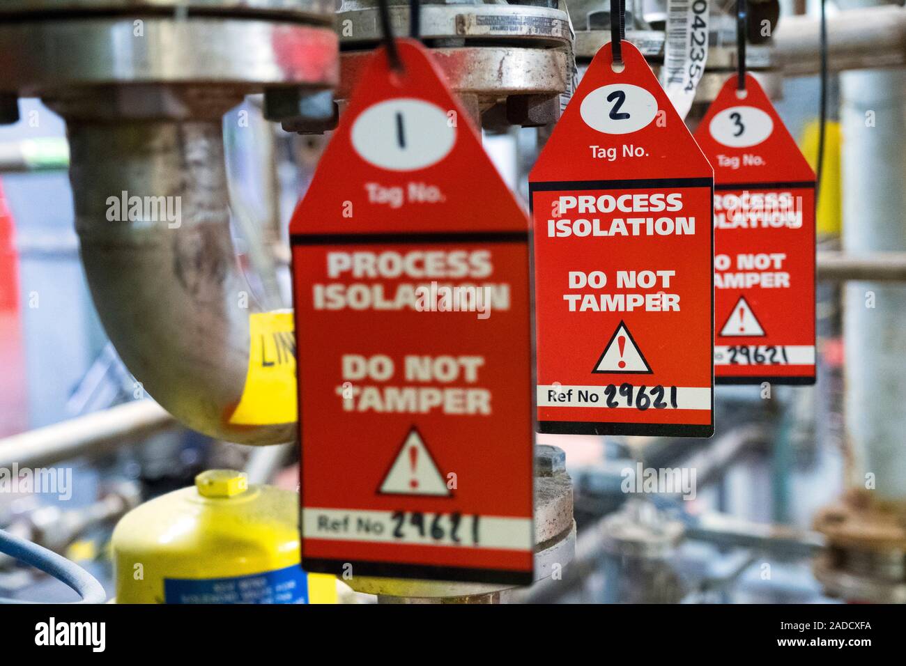 CalaChem chemical factory. Process isolation tags on pipes at the ...