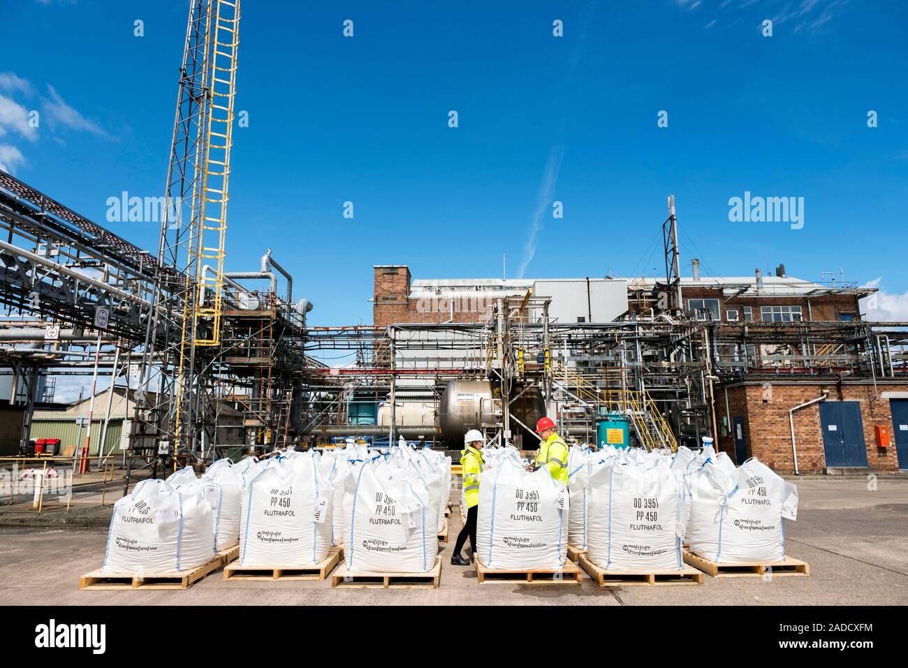 CalaChem chemical factory. Workers checking sacks of flutriafol ...