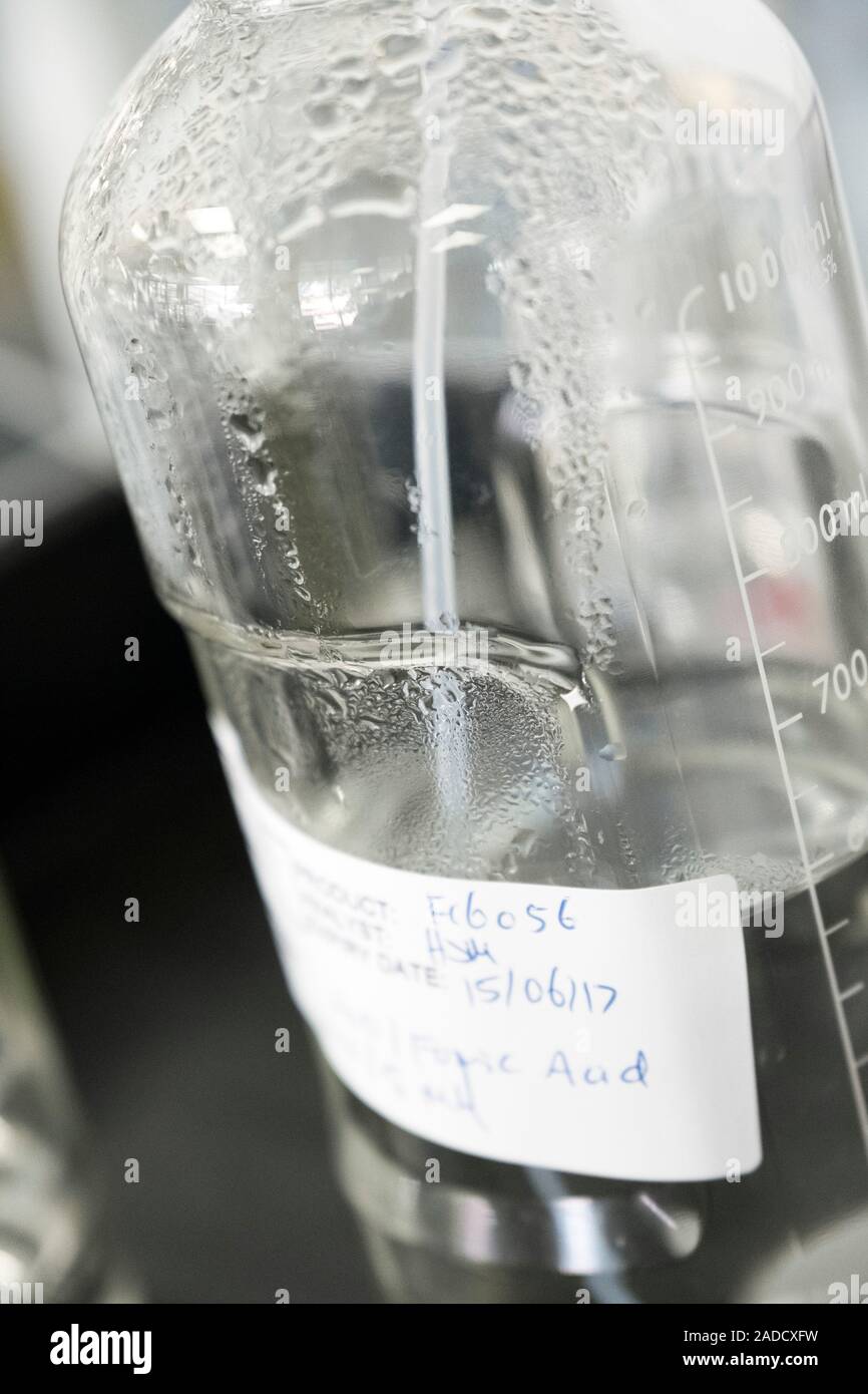 CalaChem chemical factory. Close-up of a chemical being analysed in an ...