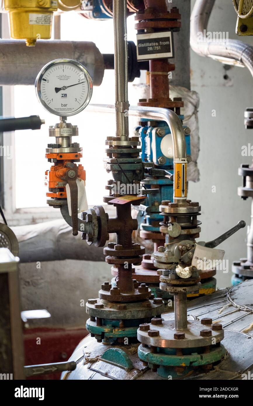 CalaChem chemical factory. Pressure gauge on a large stainless steel ...