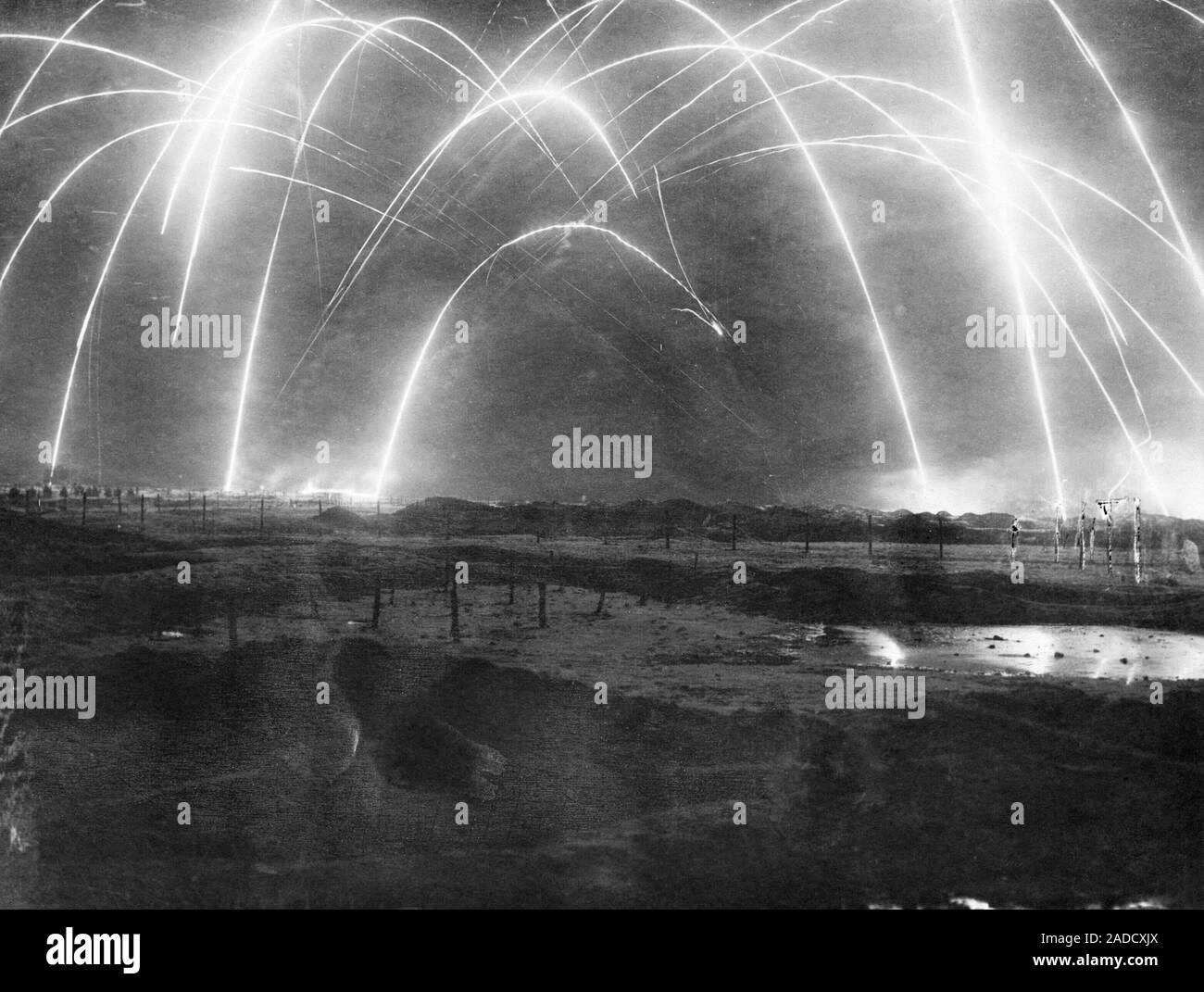 Night drill by British troops, First World War. Shells being fired on ...