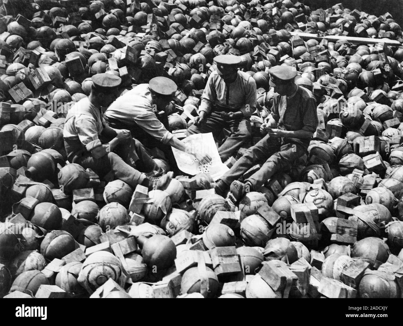 Card game on trench mortar shells, First World War. British soldiers ...
