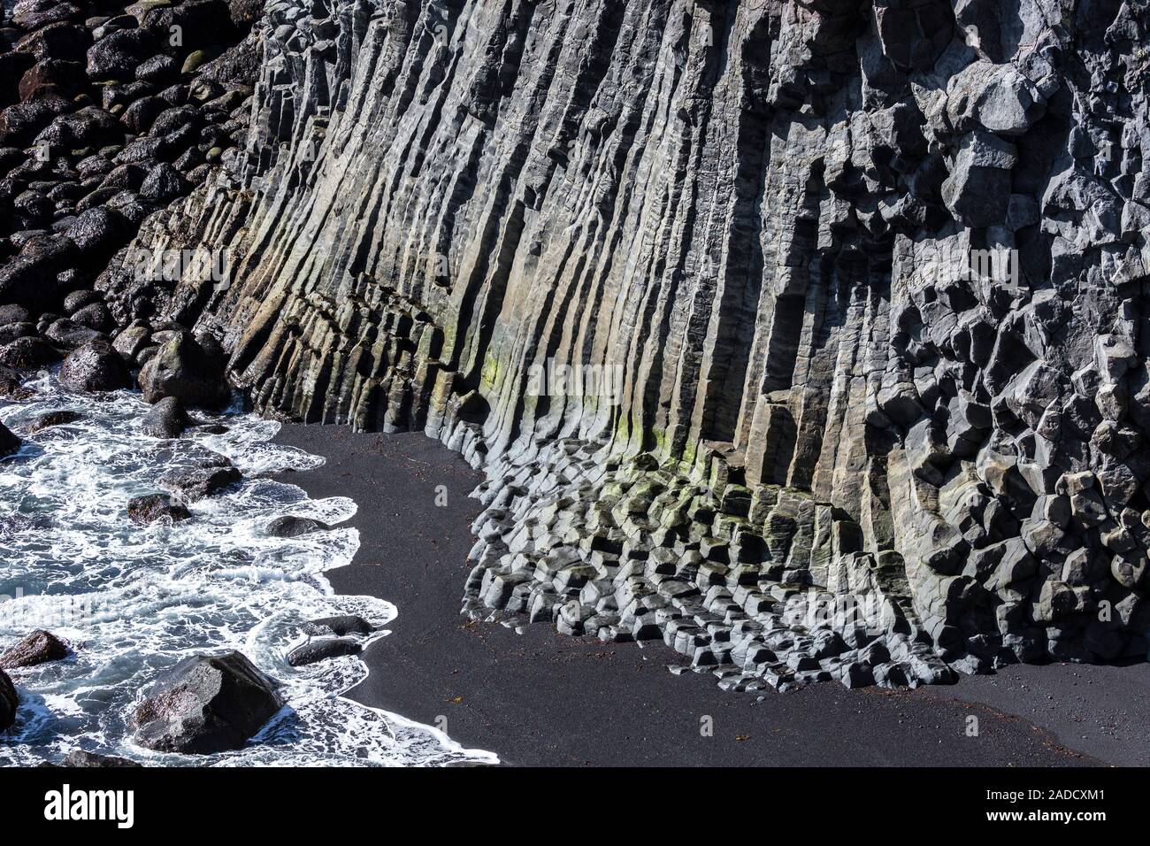 When deep flows of liquid basalt flow from eruptions it may cool into ...