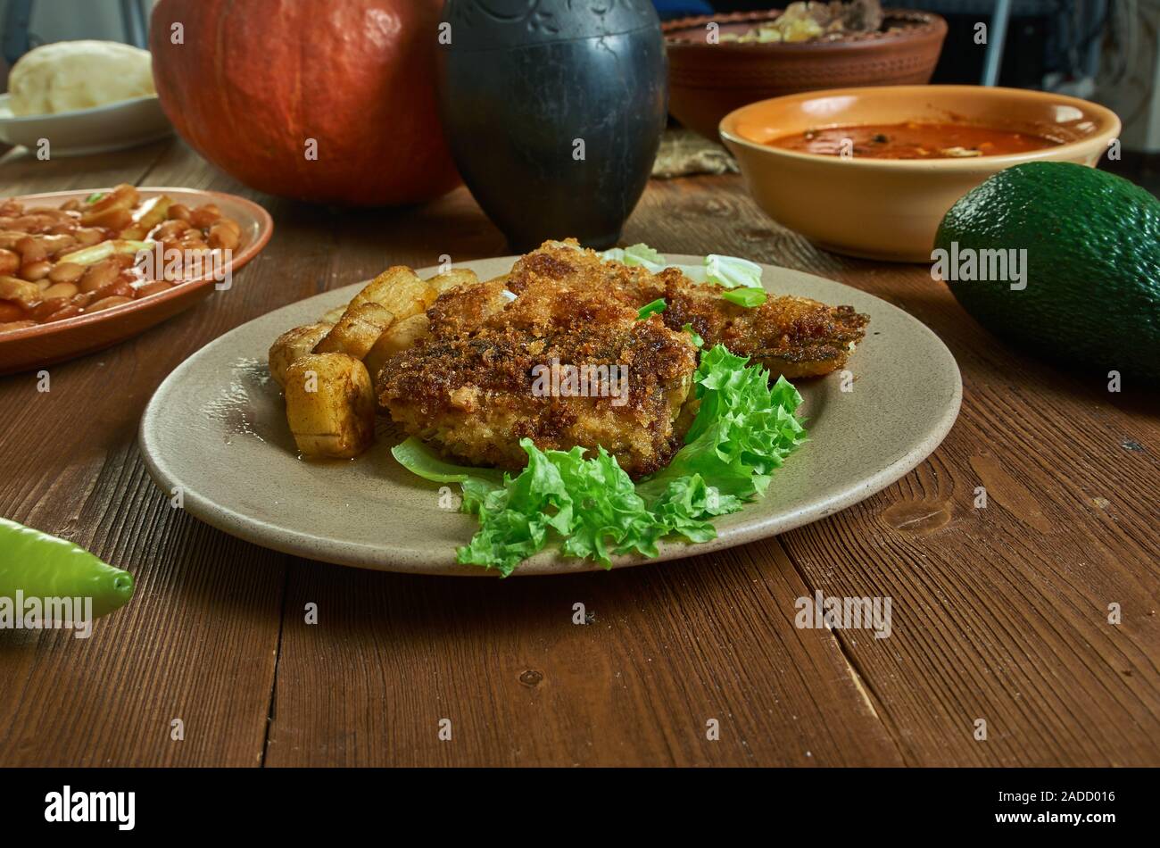 Ngolo, fried fish with bananas, Congolese cuisine, Traditional assorted ...