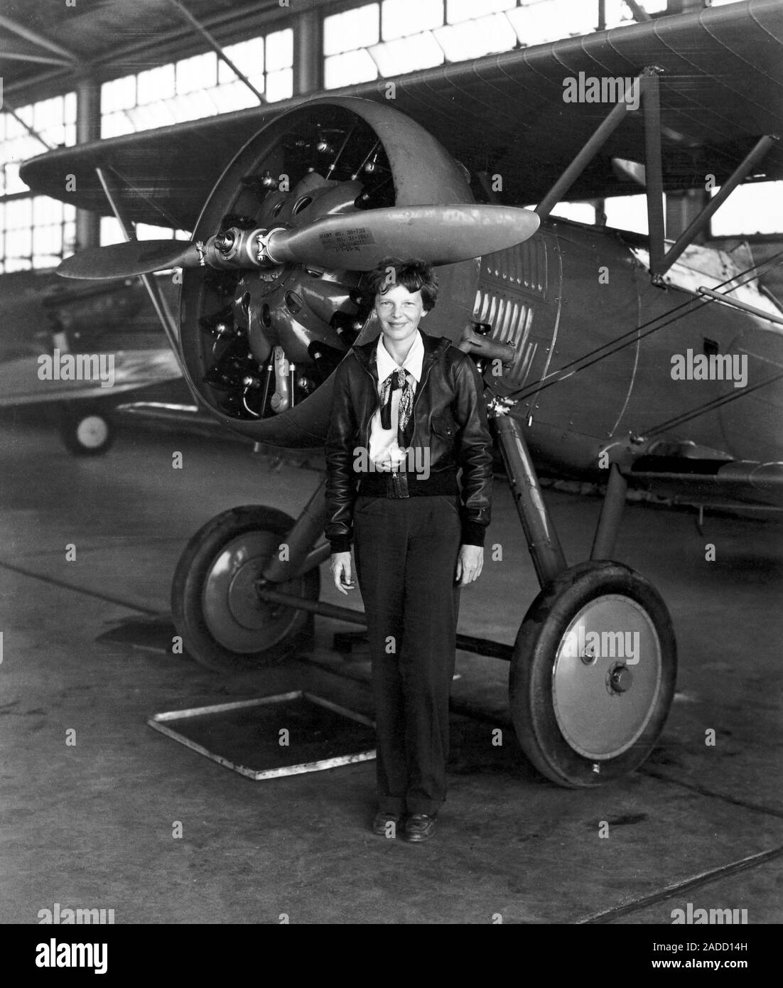 Amelia Earhart (1897-1937), US aviation pioneer, in front of her plane ...