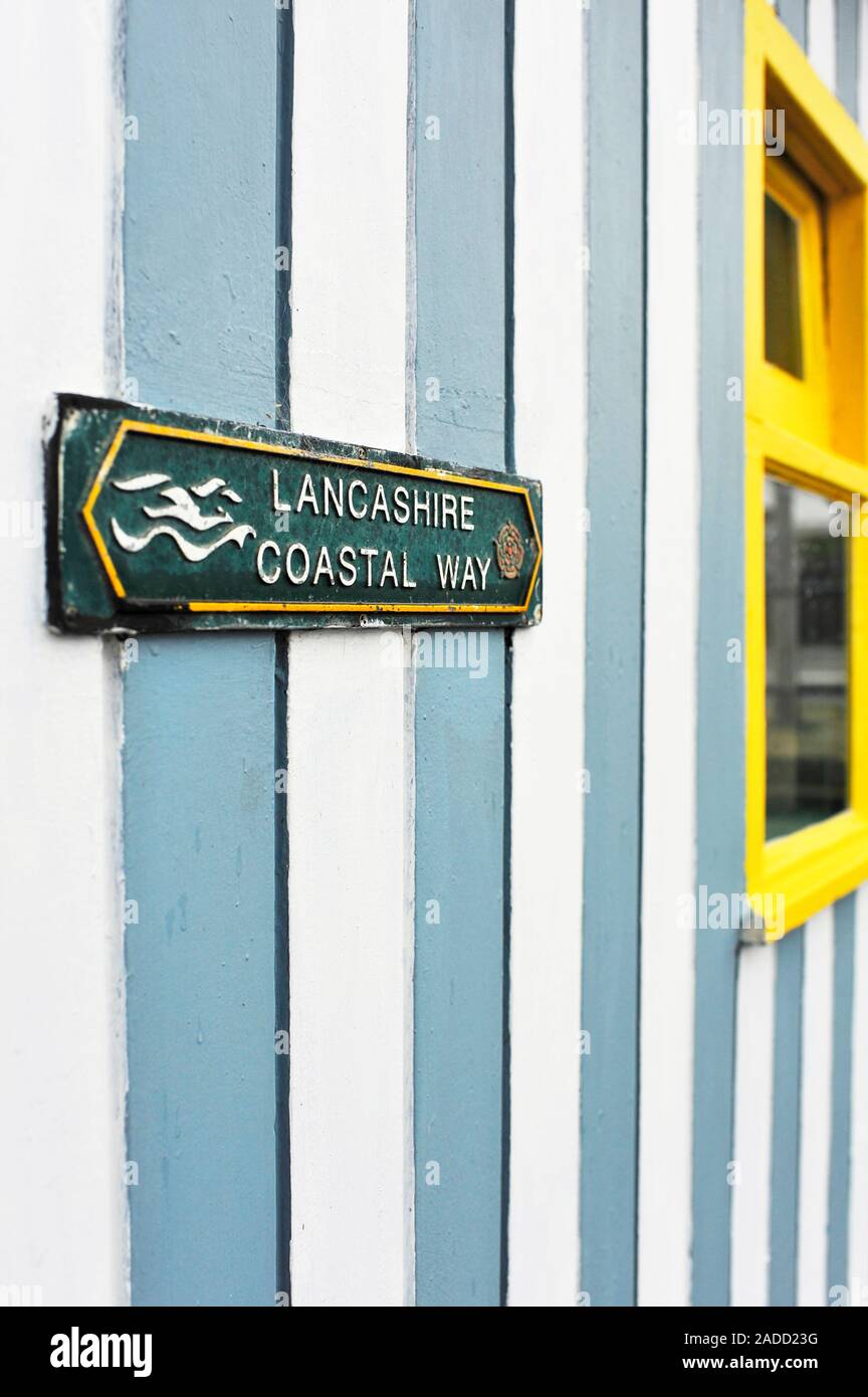 Lancashire coastal way sign attached to building with blue and white ...