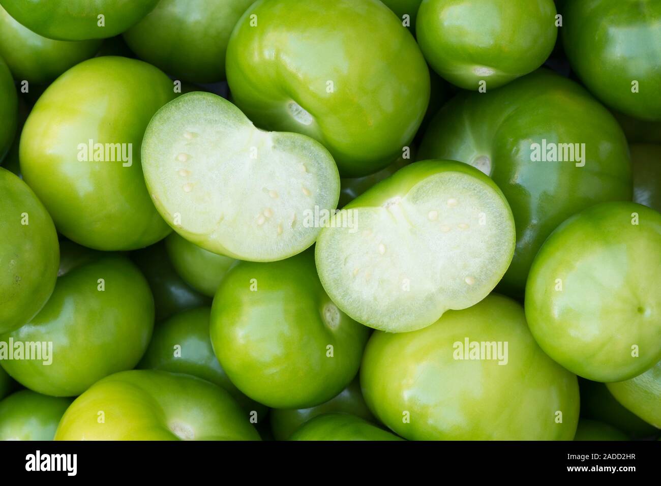 Sectioned tomatillos with husks removed. Ripe Mexican tomatillos ...