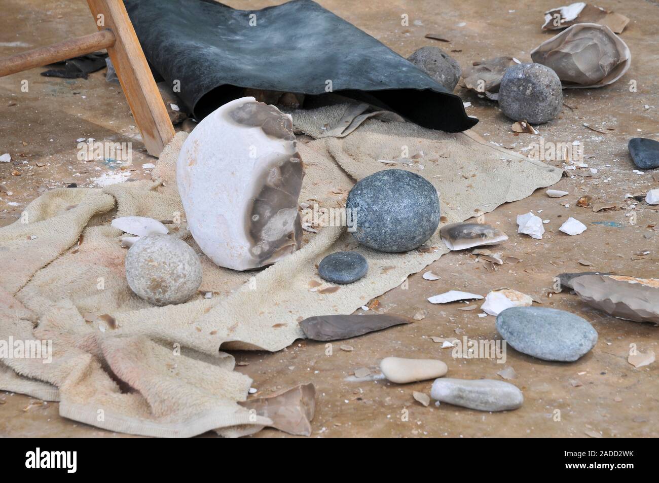 Demonstration of the production of tools from flint stone at the of the ...