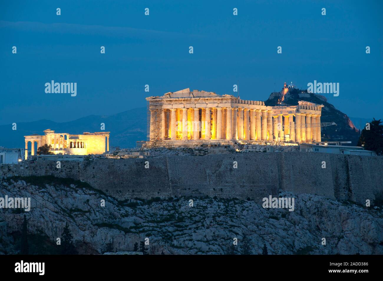 Parthenon on the Acropolis of Athens, Greece, lit by lights in the evening. This Doric temple ...