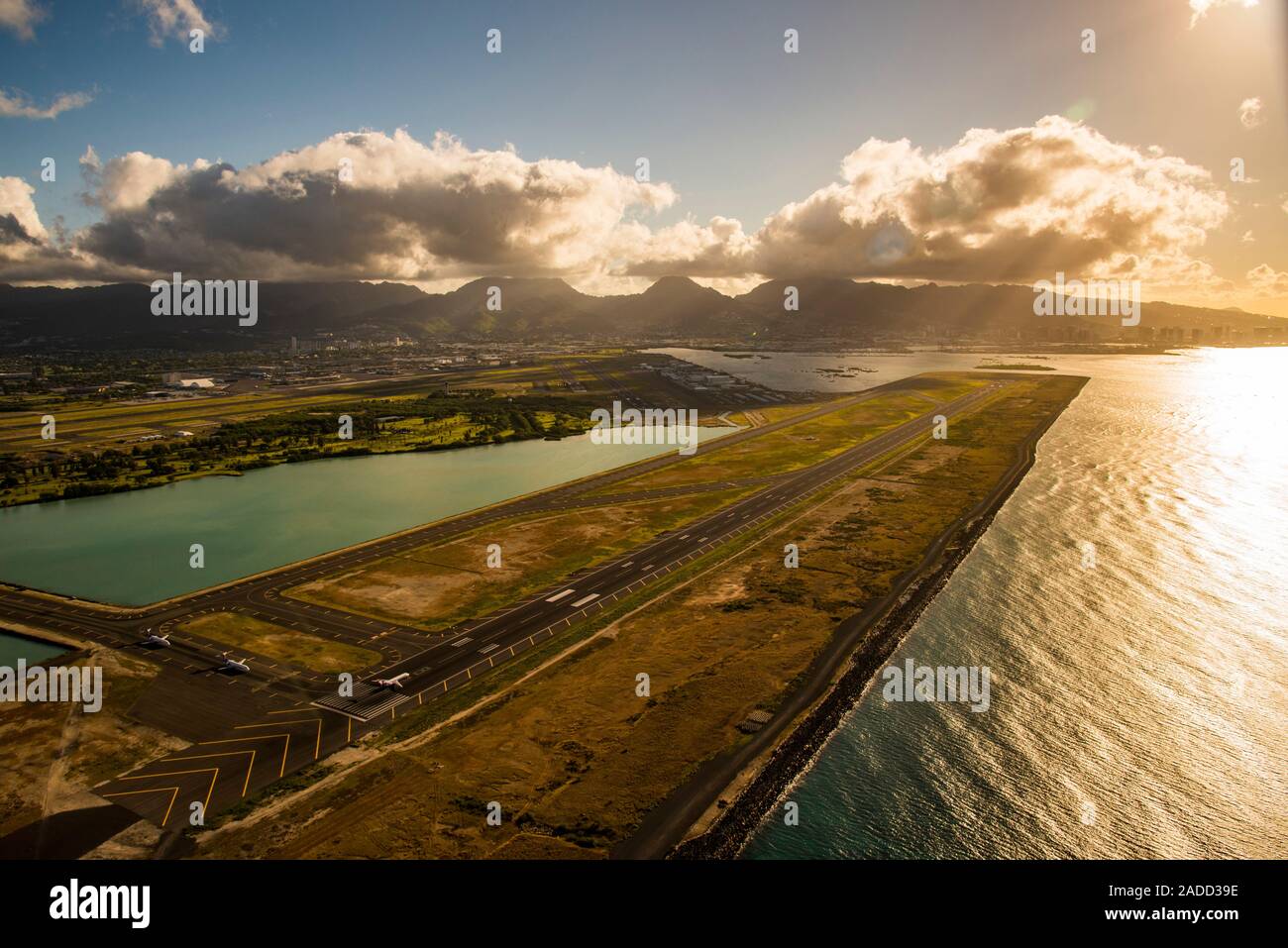 Aerial photograph of Honolulu International Airport runway at sunrise ...