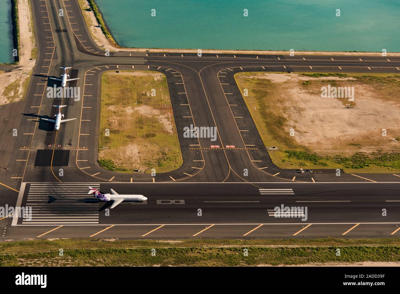 Aerial photograph of Honolulu International Airport runway at sunrise ...