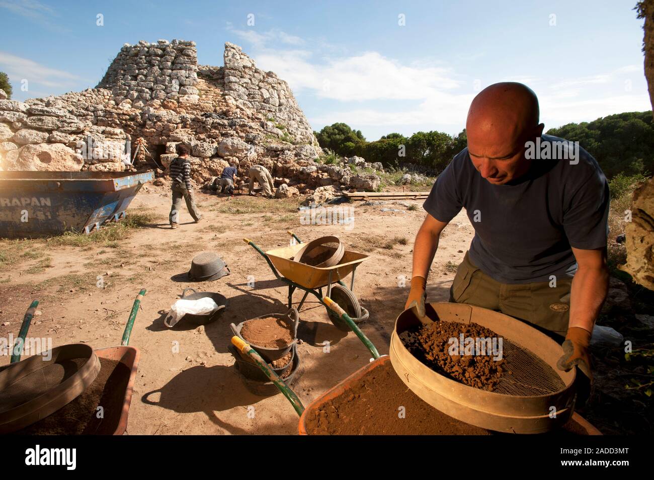 Excavations at Talaiotic prehistoric tower, Menorca. Archaeologist ...