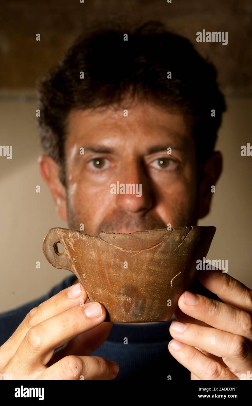 Archaeologist with a talaiotic cup, Menorca. This artifact dates from ...