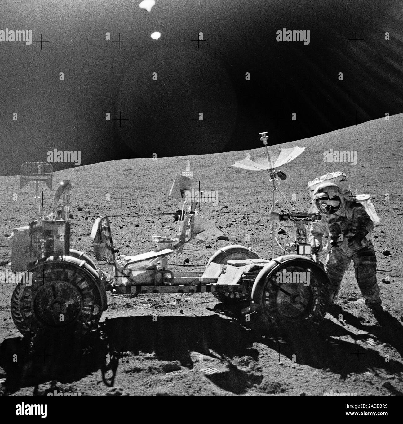 Apollo 16 exploration of the Moon. NASA astronaut with a lunar rover on ...