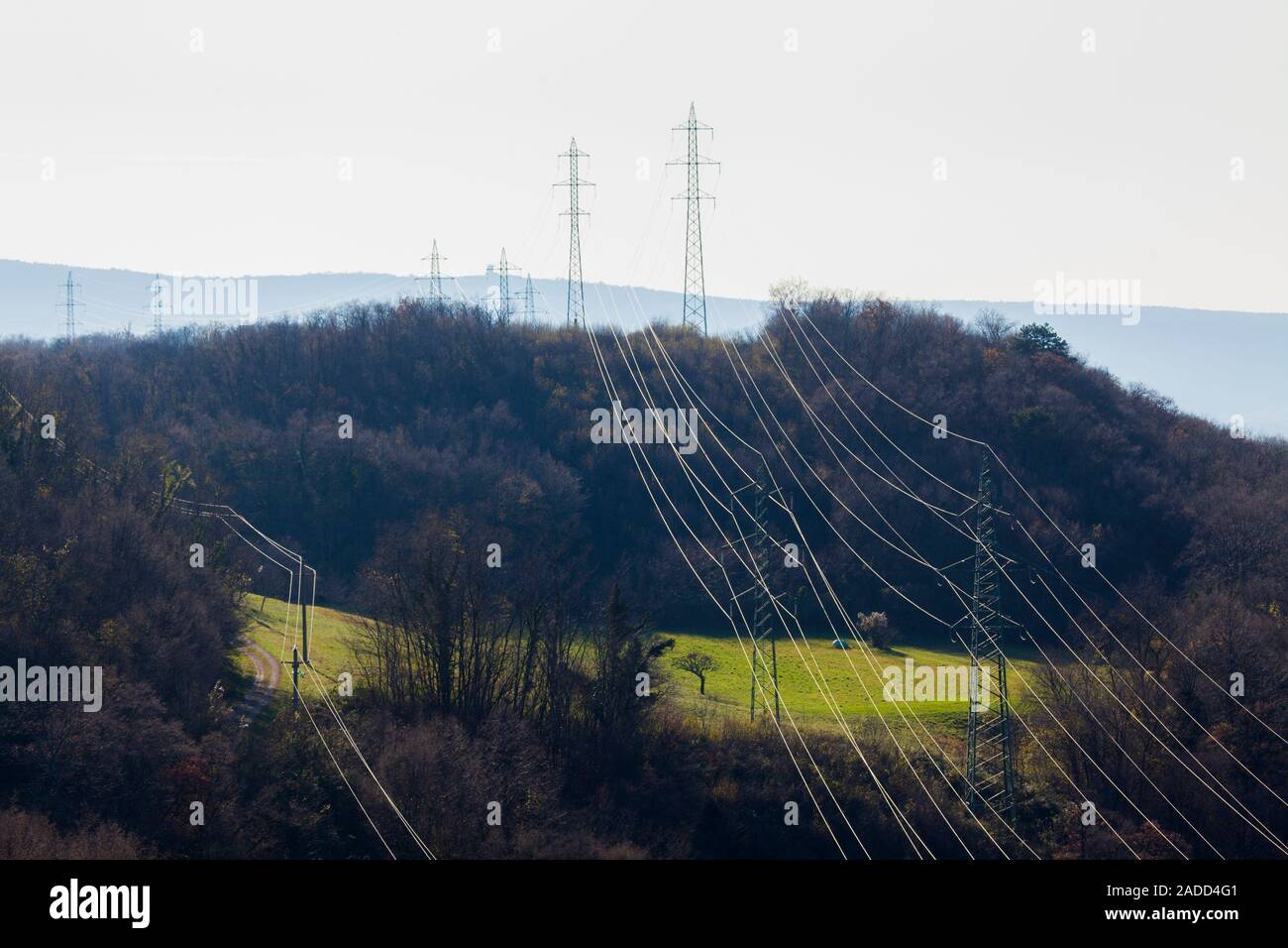 electric high voltage power lines while crossing beautiful scenery ...