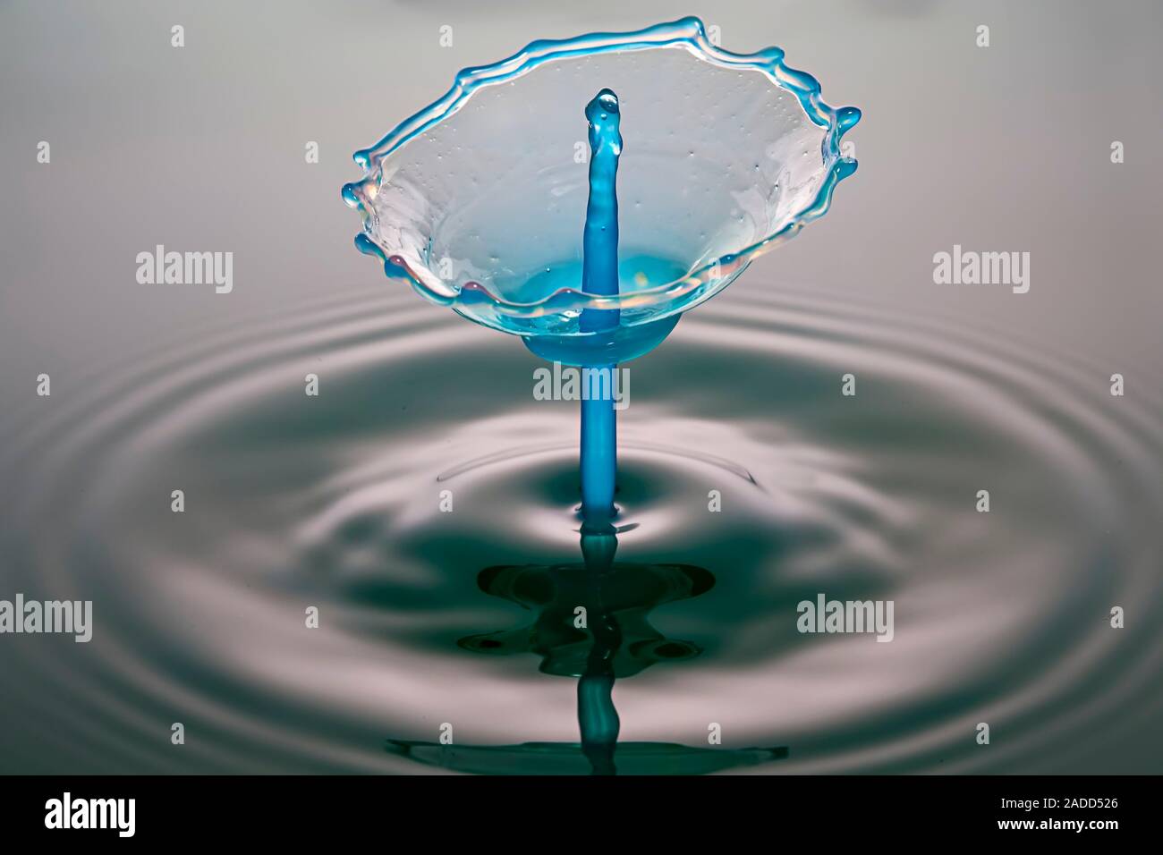 Water drop impact. High-speed photograph of secondary drop formation ...
