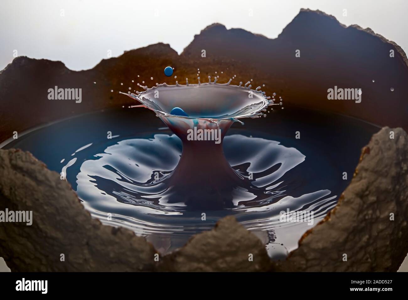 Water drop impact. High-speed photograph of secondary drop formation ...