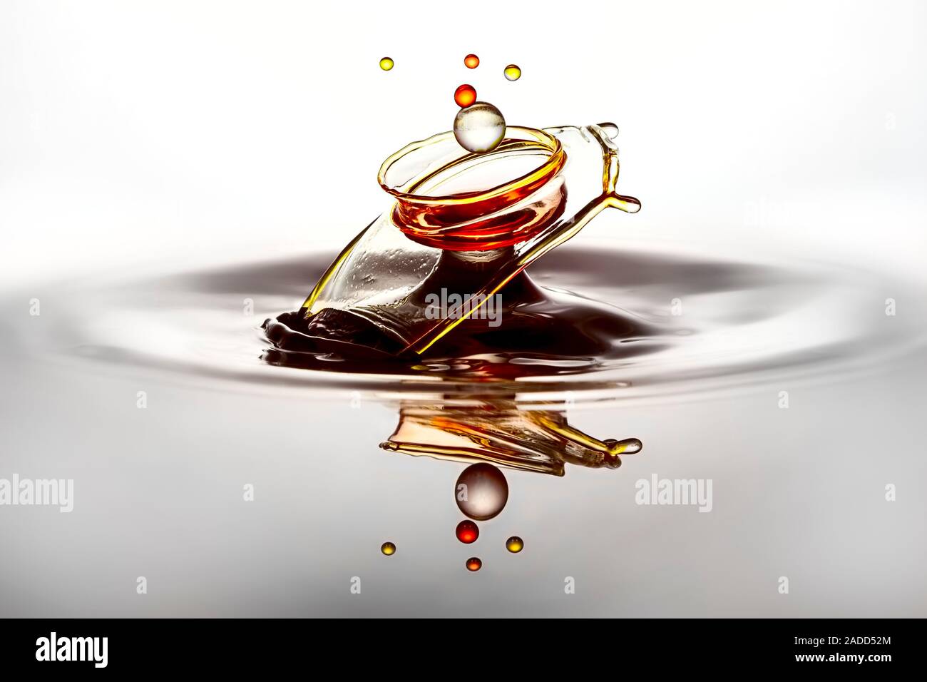 Water drop impact. High-speed photograph of secondary drop formation ...