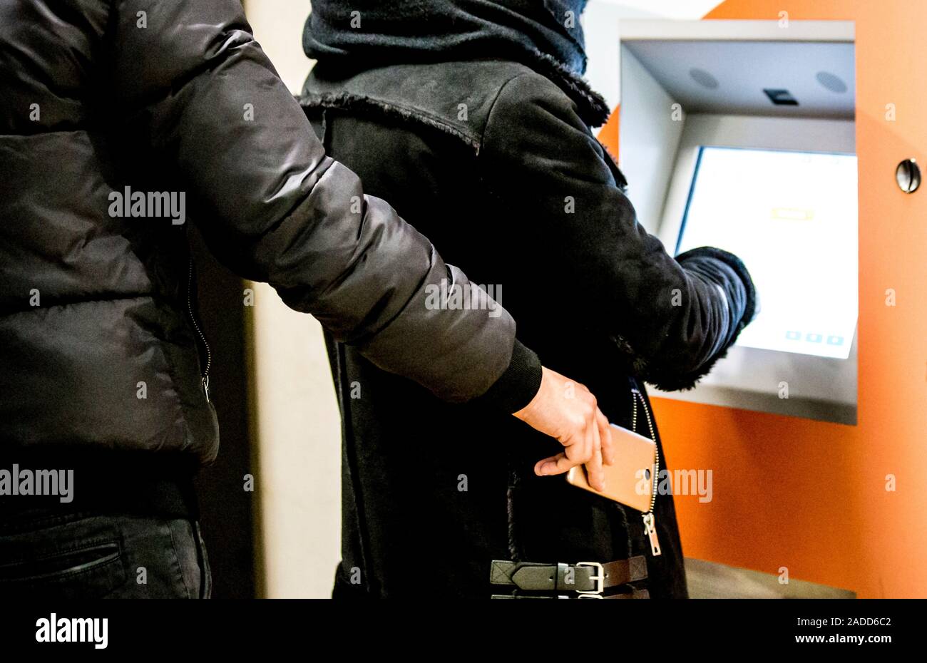 Pickpocket. Person stealing a young woman's phone from her pocket Stock ...
