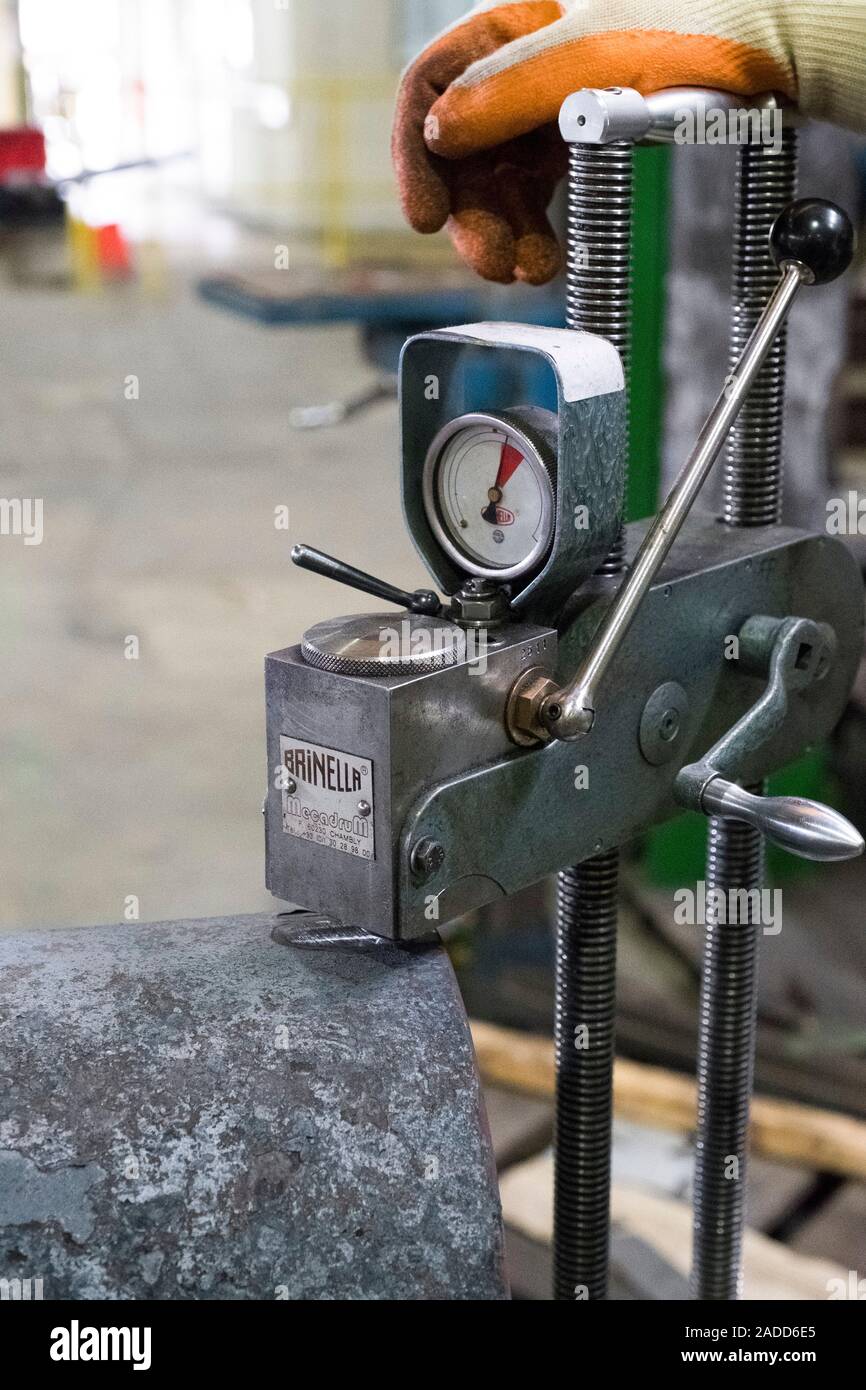 Metalworks. Finished steel tube section undergoing mechanical testing ...