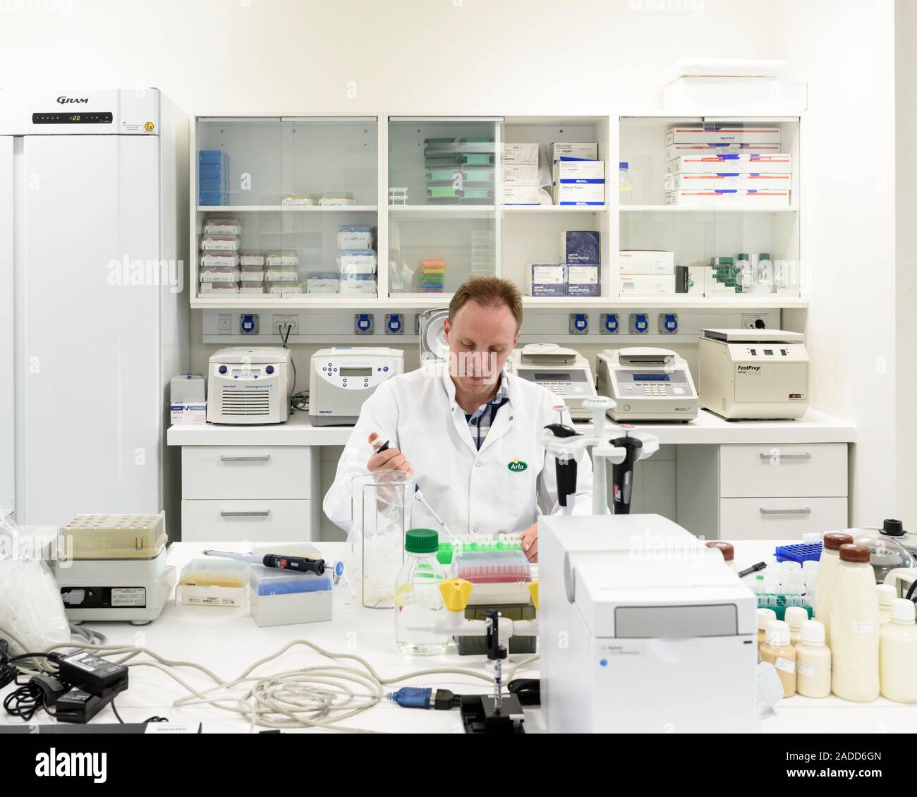 Prototype milk-based food products. Technician developing experimental ...