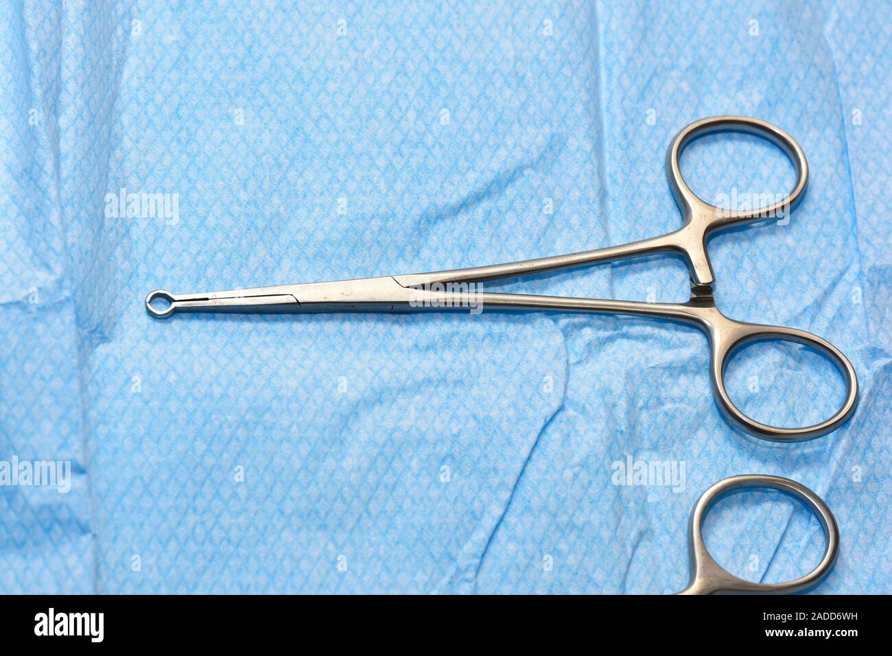 Vasectomy ring clamp. This instrument, also known as a fixation clamp ...