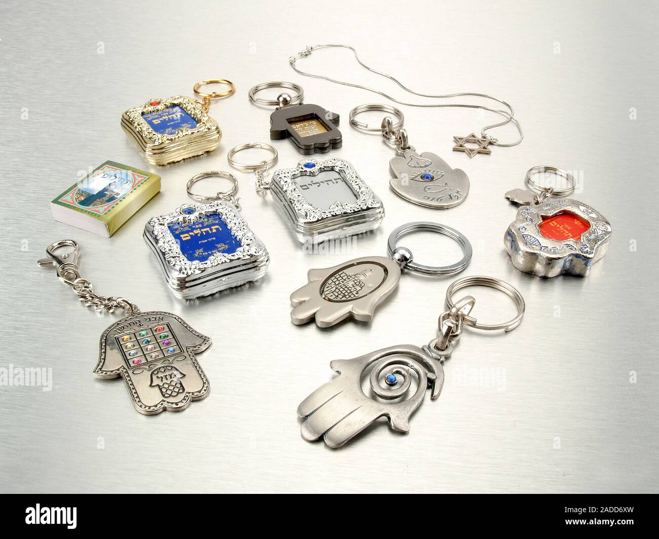 Small Judaica symbols. Hamsa, Magen David, and Tehillim charms These ...