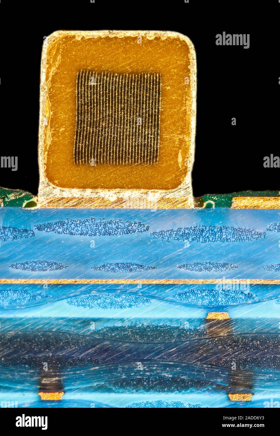 Light micrograph of a section through a computer printed circuit board ...