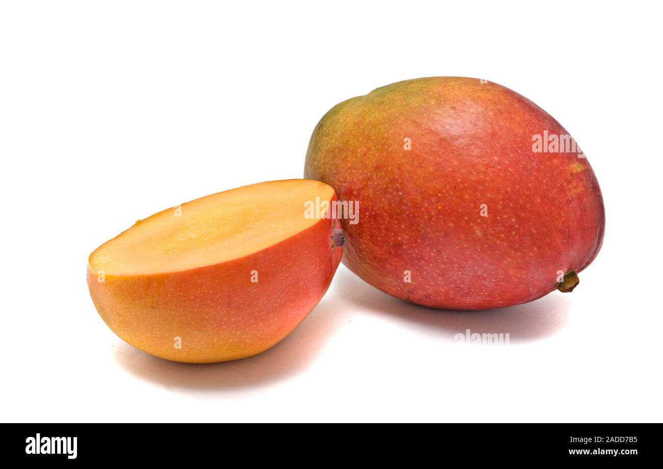 Mango and mango section isolated on white background Stock Photo - Alamy
