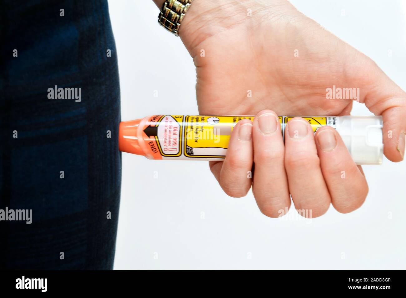 EpiPen adrenaline device being used to inject adrenaline. This is used ...
