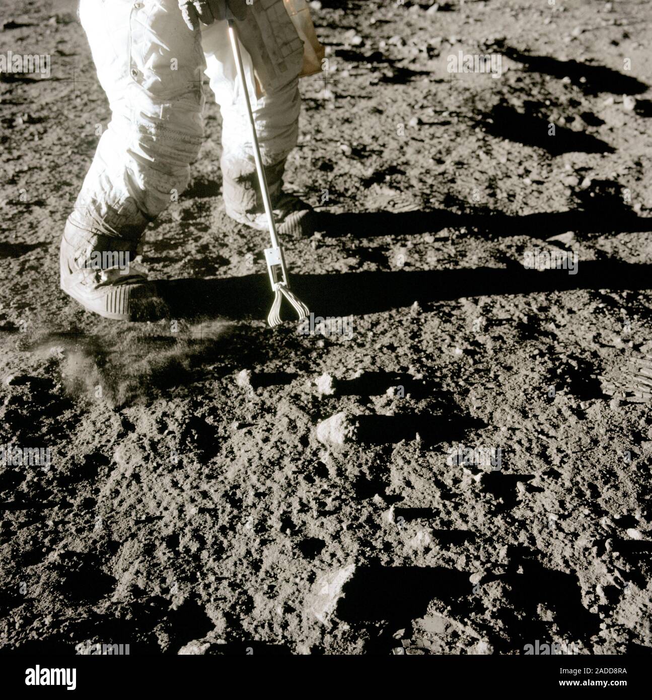 Apollo 12 astronaut using lunar hand tool. Close-up of an Apollo Lunar ...