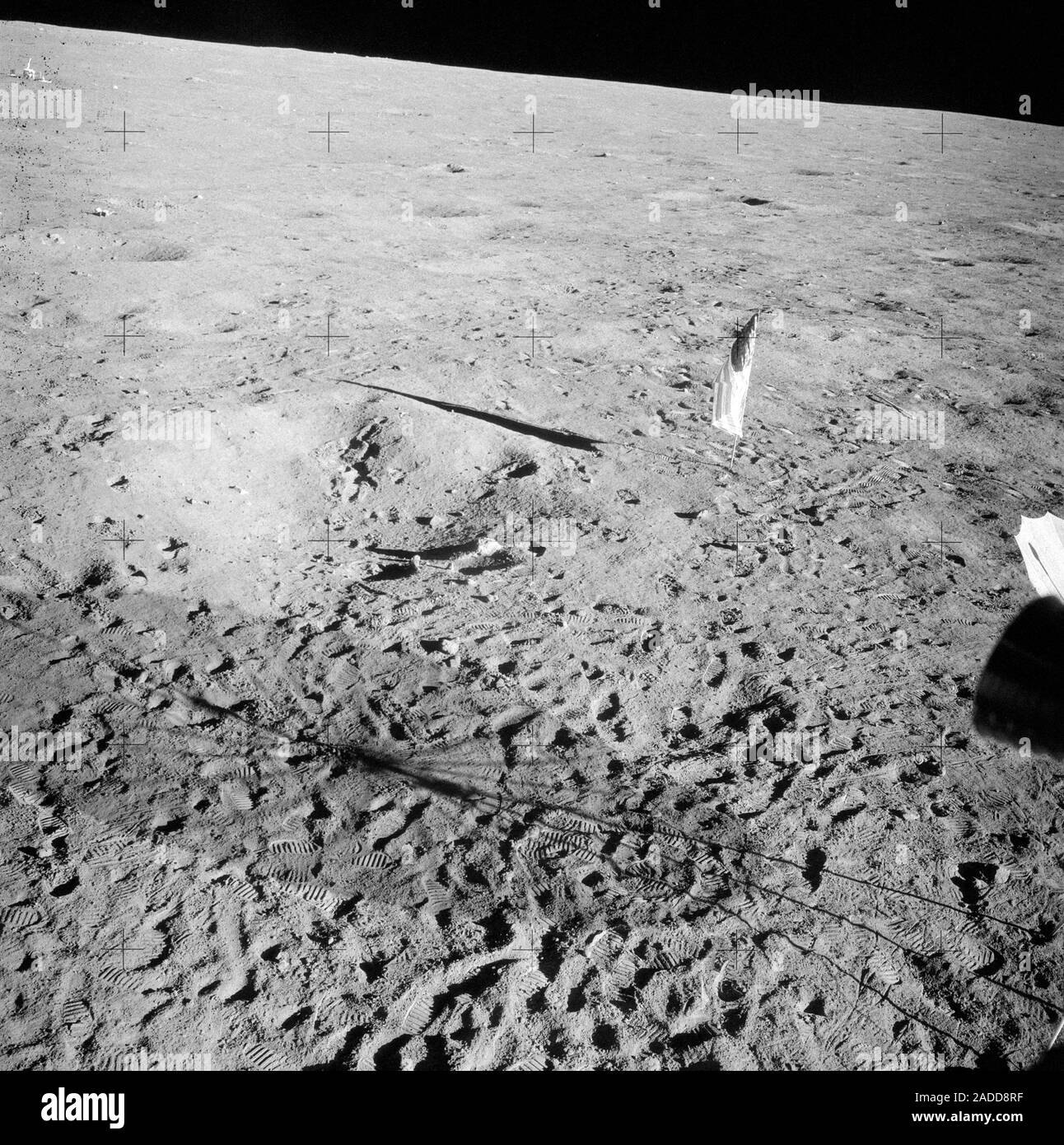 Apollo 12 footprints and shadows. US flag and footprints, with the S ...