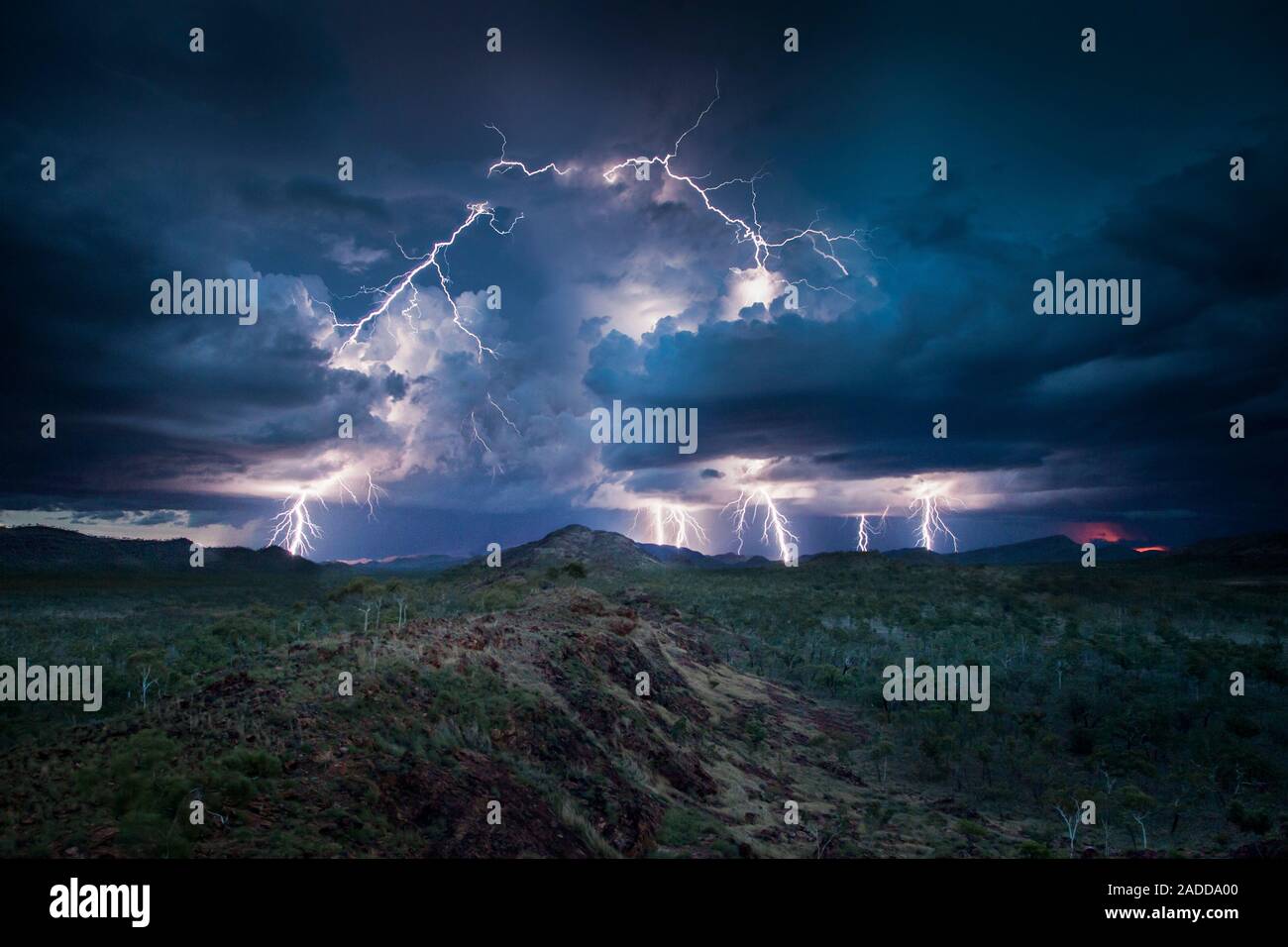 Lightning storm. Composite image of a lightning storm over mountains ...