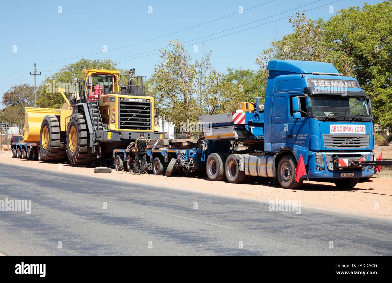 Mining vehicle transport. Mining vehicle being transported to a heavy ...