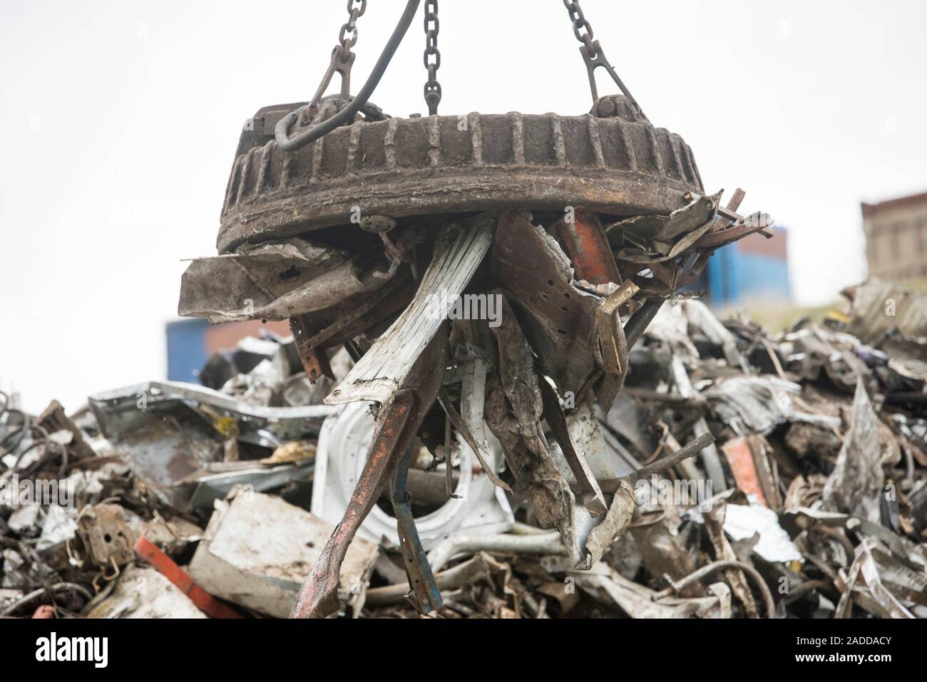 Electromagnet moving scrap metal in a scrap metal recycling yard ...