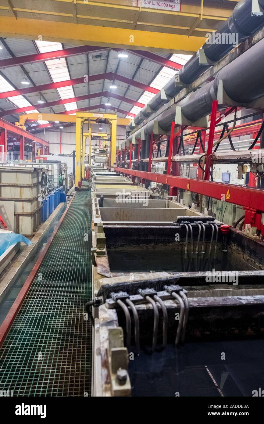 Electroless nickel plating factory. Chemical tanks and rinse tanks at a ...